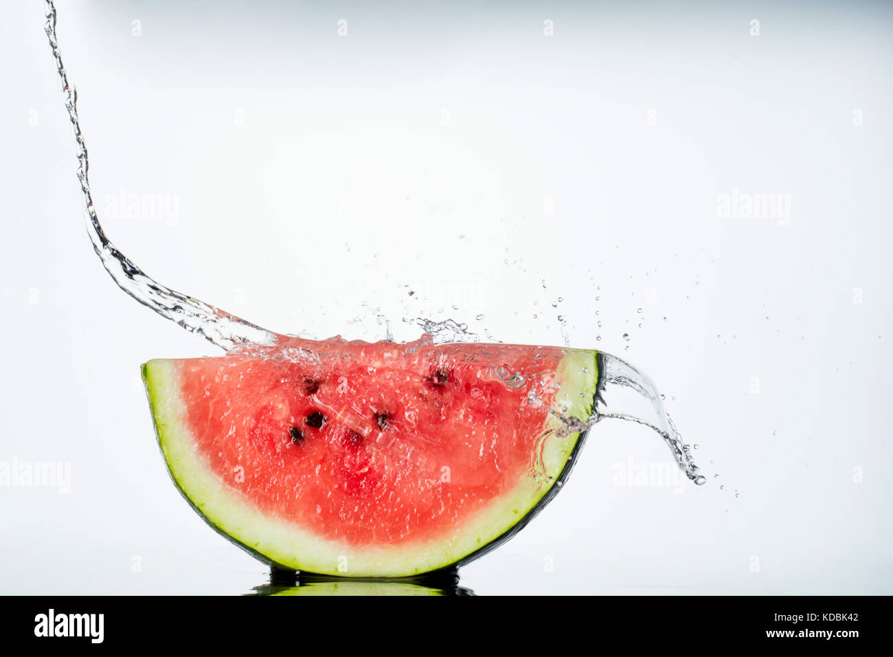 watermelon and water splash on white Stock Photo - Alamy
