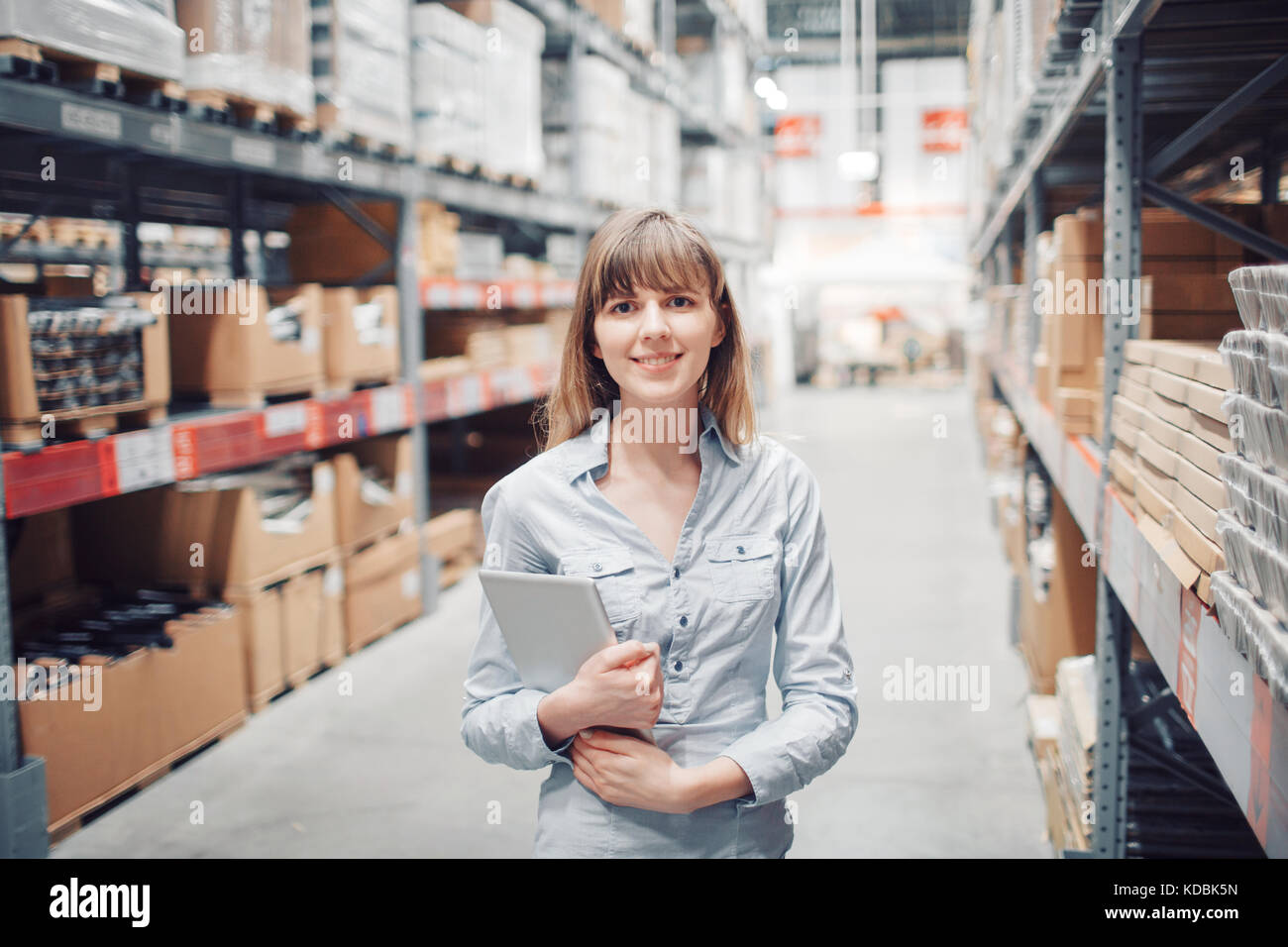 stock taking. beautiful young woman worker of furniture store Stock ...