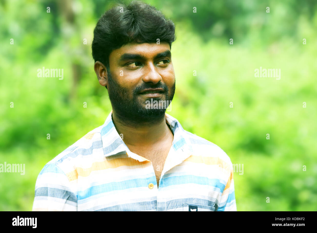 portrait of a man standing outside in park Stock Photo - Alamy