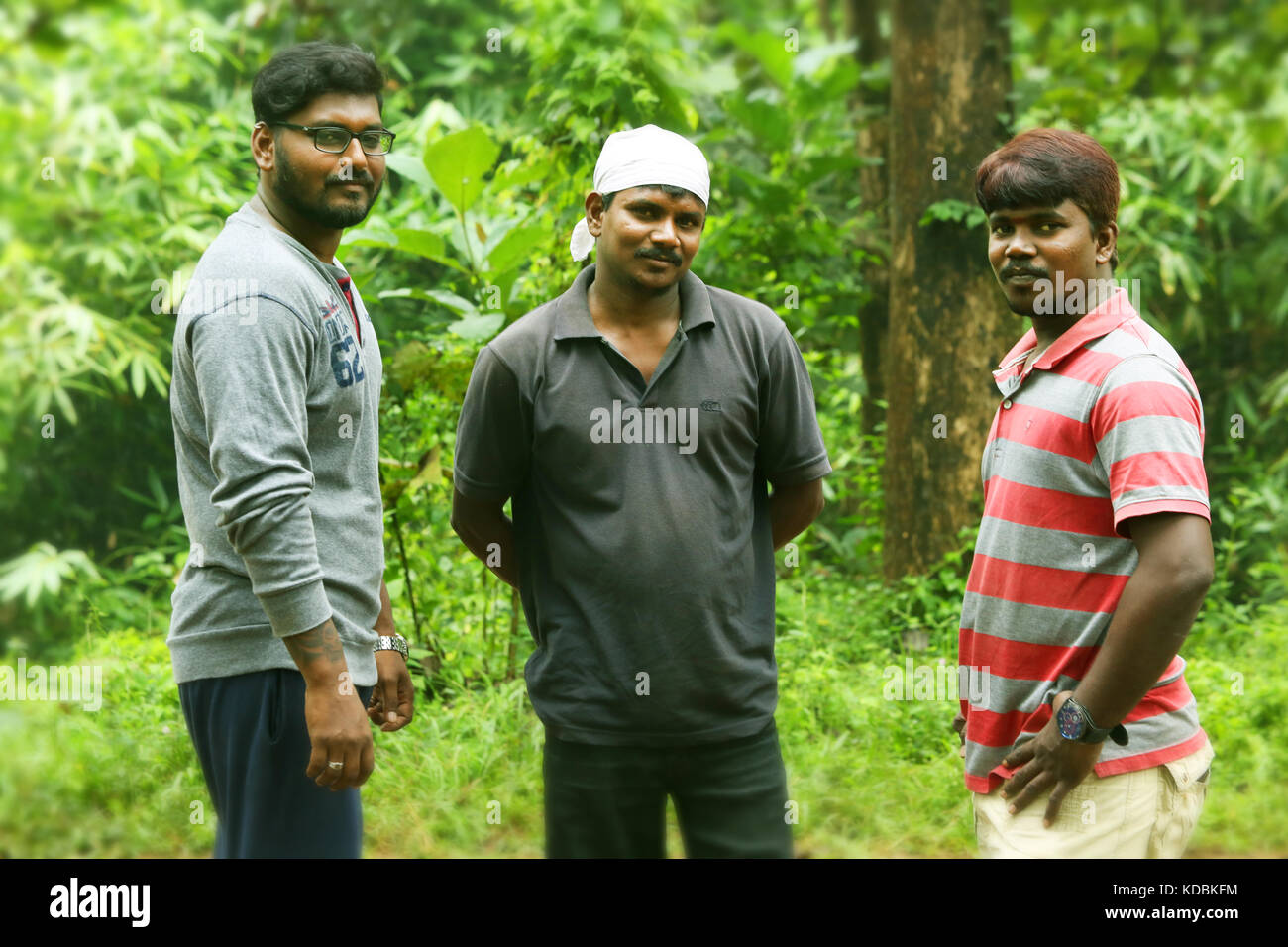 Portrait of three guys looking at camera Stock Photo - Alamy