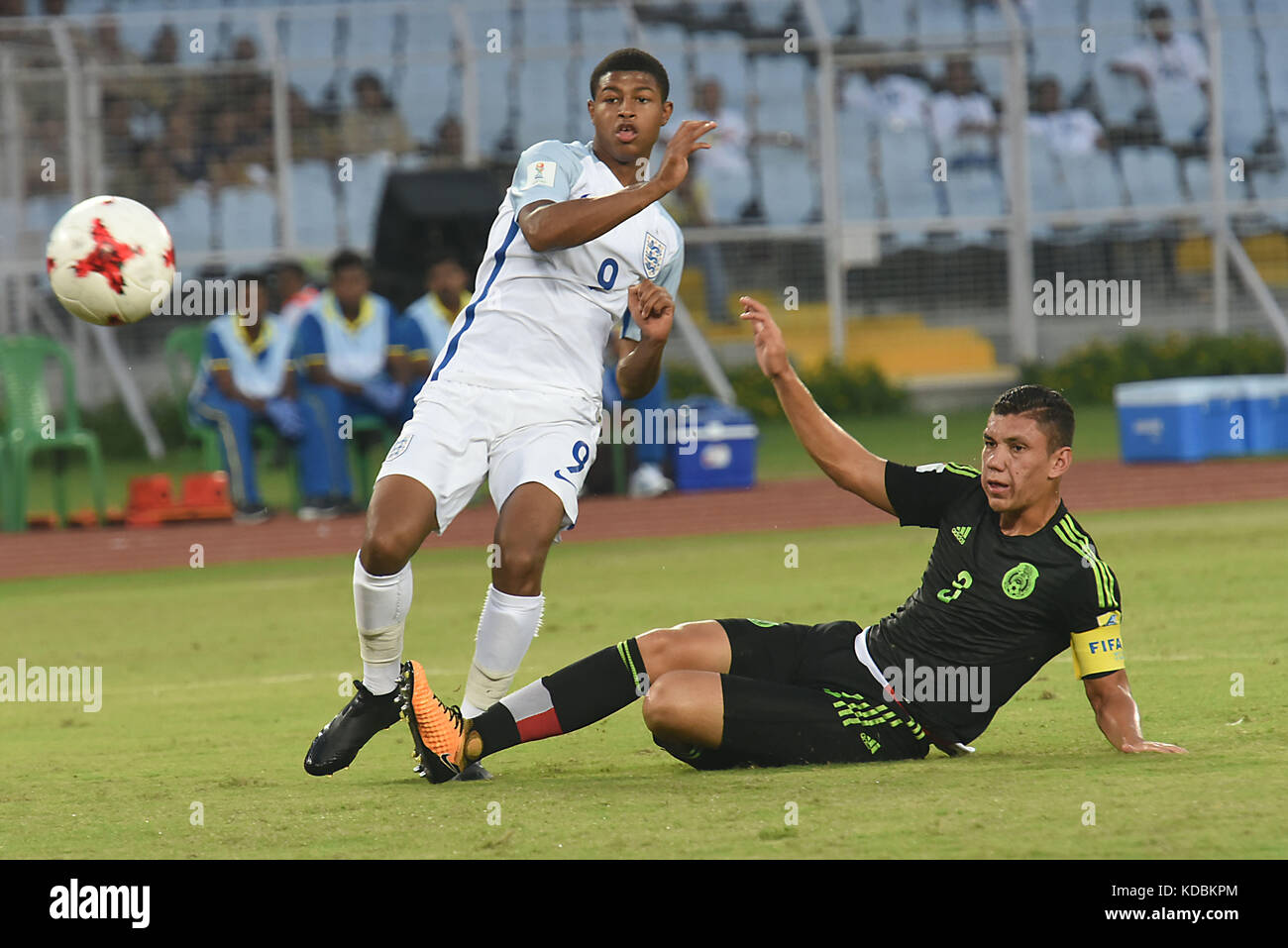 Rhian Brewster (C) of England battles for the ball with goalkeeper ...