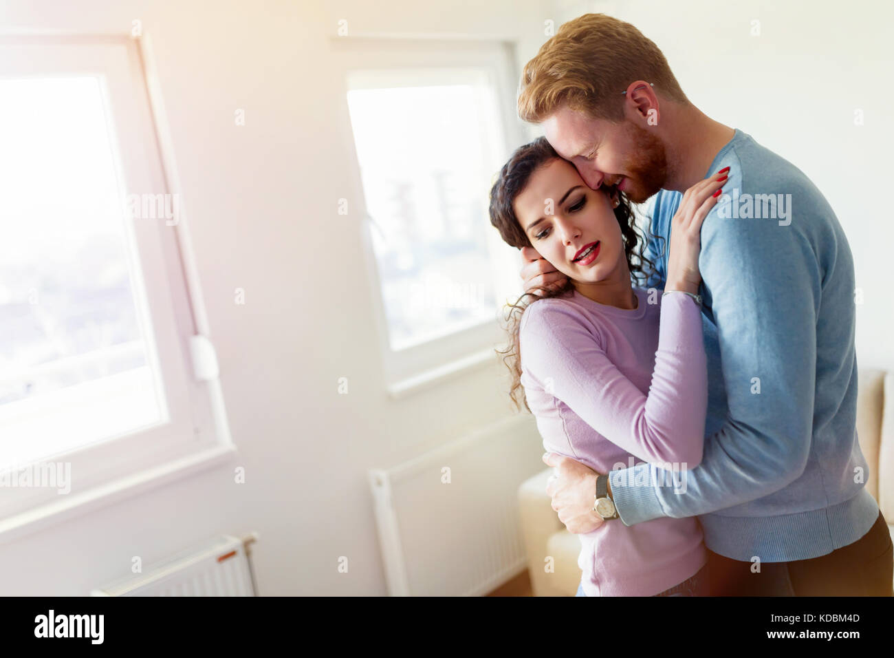 Young happy couple having romantic times at home Stock Photo - Alamy