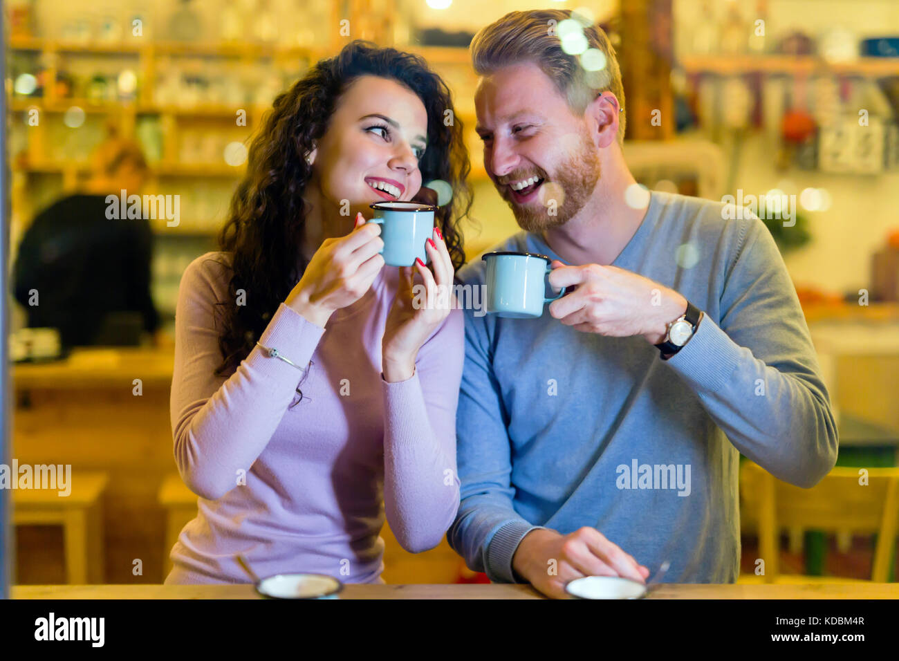 Romantic couple having date in coffee shop Stock Photo - Alamy