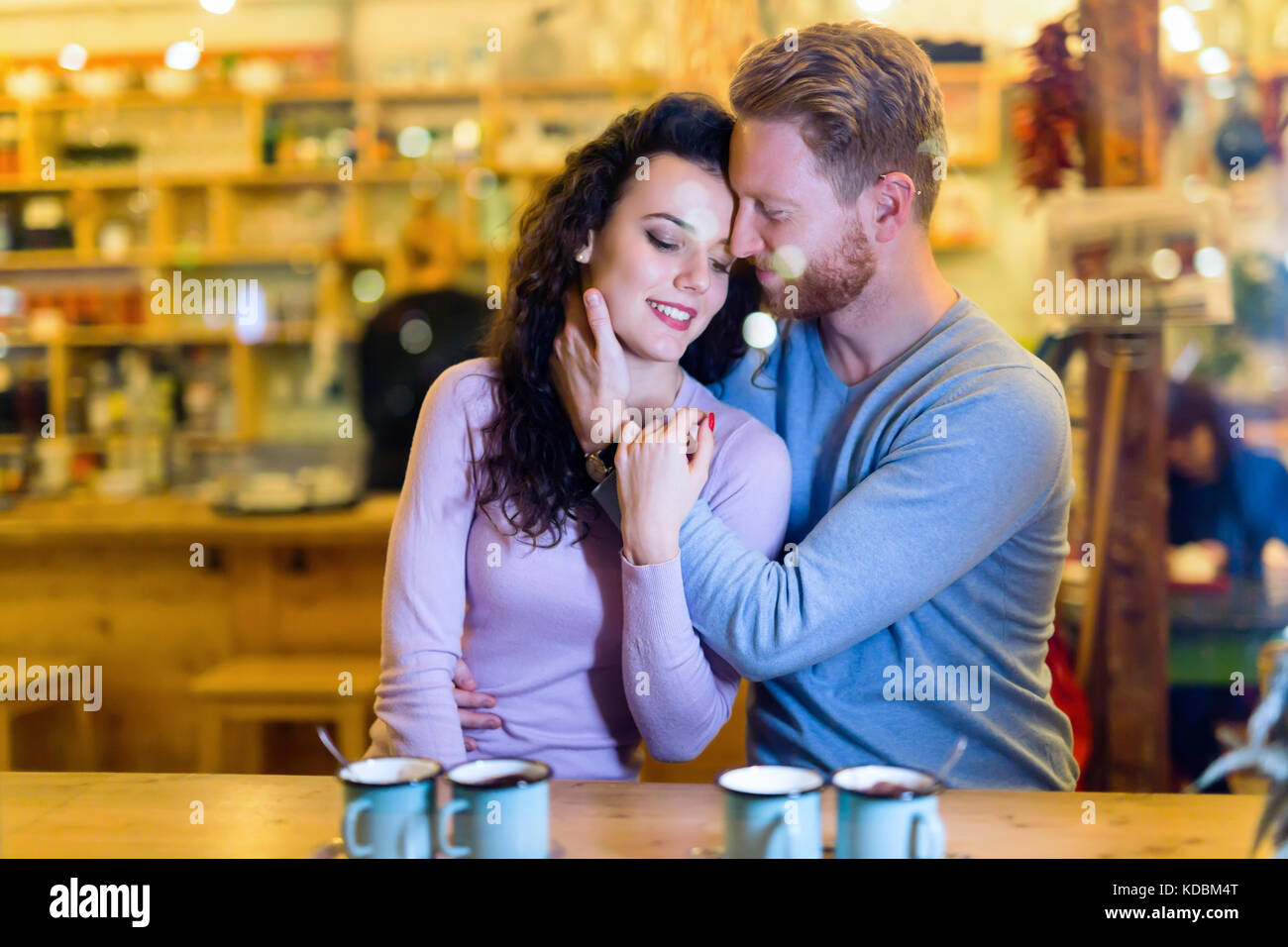 Romantic couple having date in coffee shop Stock Photo - Alamy