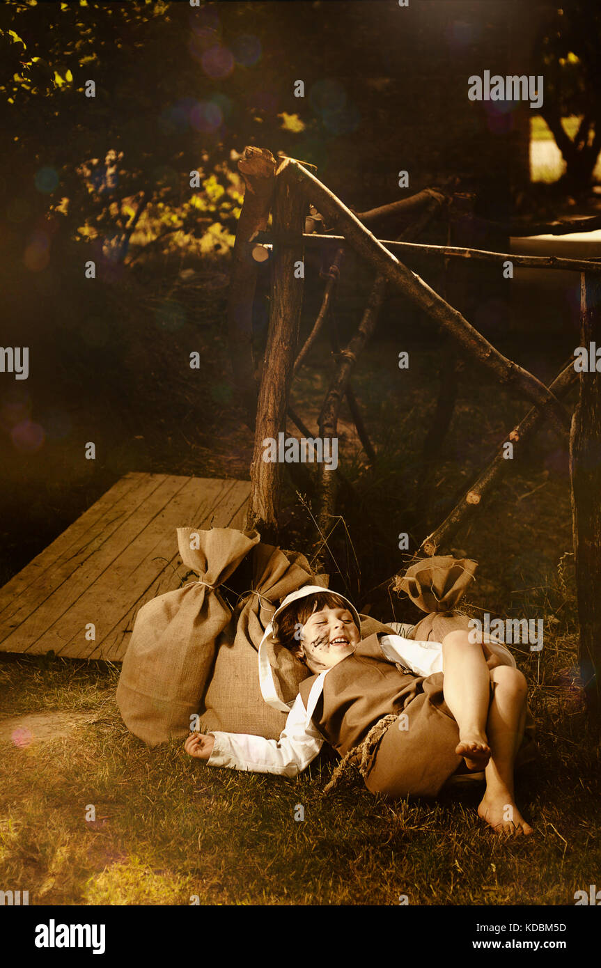 Smiling medieval style girl have a rest Stock Photo - Alamy