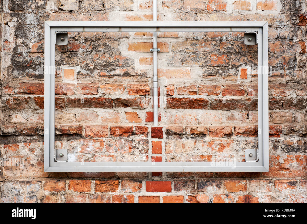 Metal Frame On A Brick Wall Stock Photo - Alamy