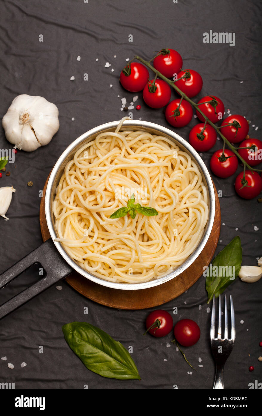Closeup of delicious spaghetti in a pan. Top view Stock Photo - Alamy