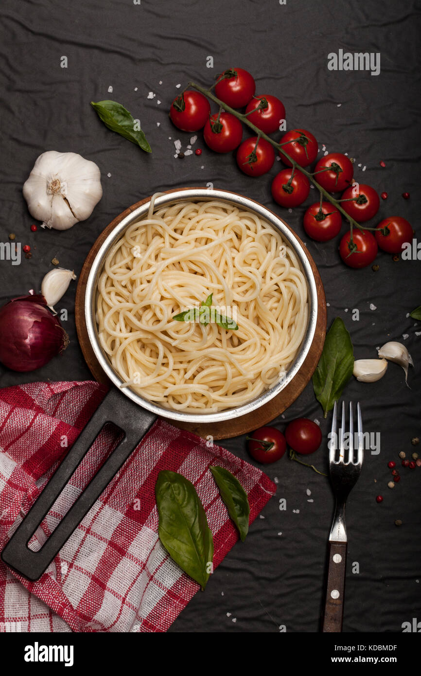 Closeup of delicious spaghetti in a pan. Top view Stock Photo - Alamy