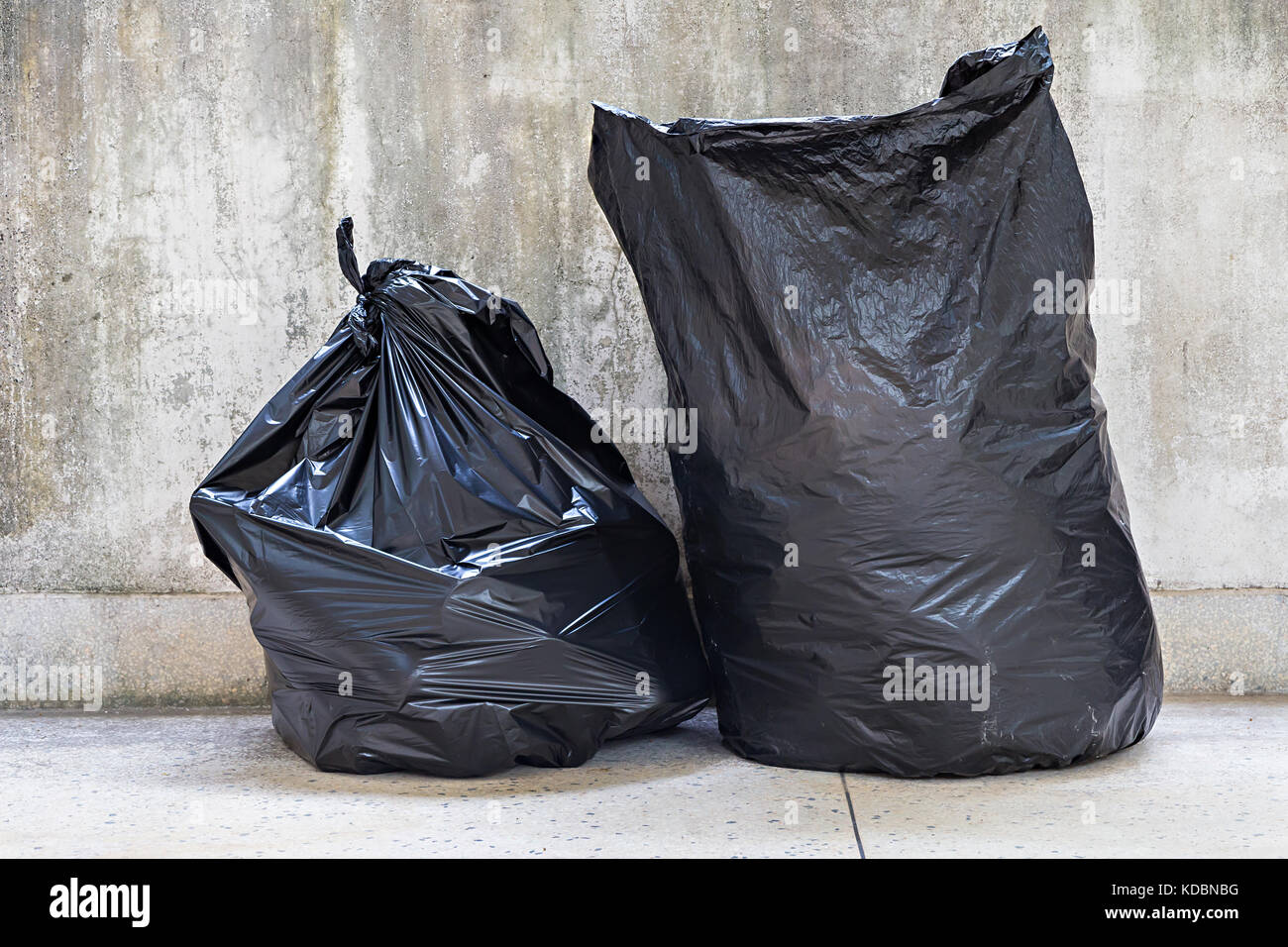 close-up of a full garbage bags on floor Stock Photo - Alamy