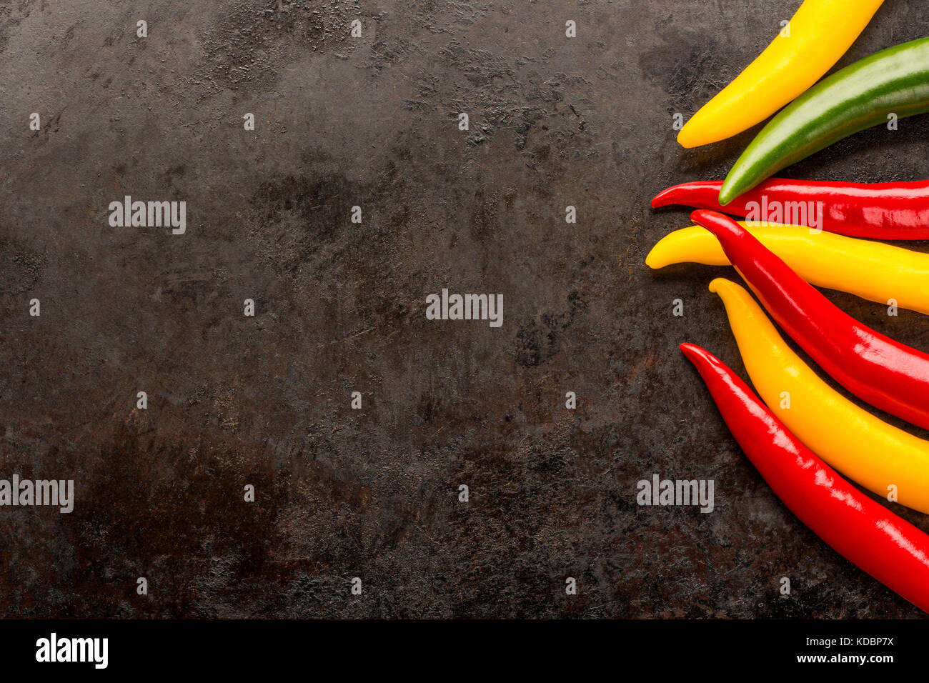 cayenne chilli peppers on rusty metal background Stock Photo - Alamy