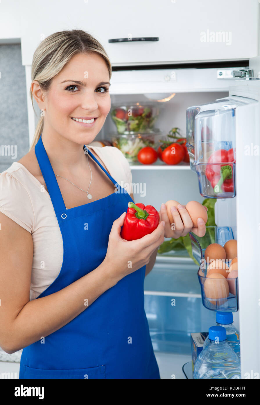 Blonde woman apron hi-res stock photography and images - Alamy