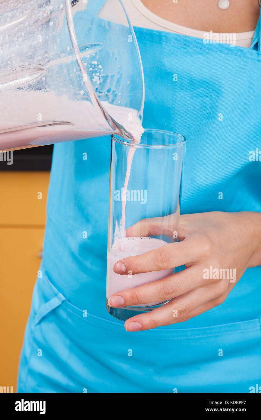 Milk Shake Pouring Glass Stock Photos & Milk Shake Pouring Glass Stock ...