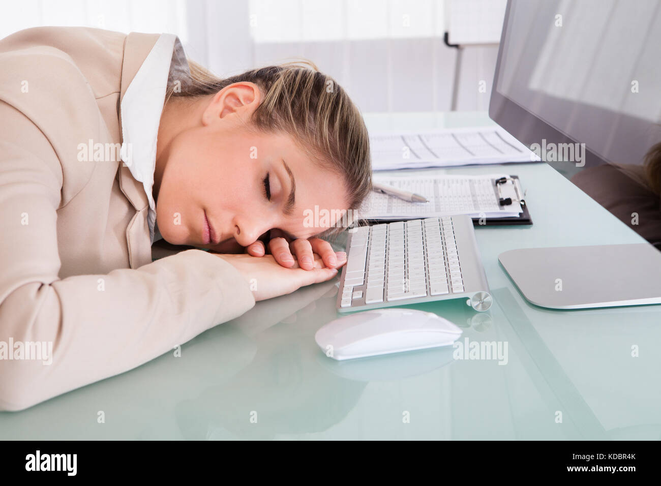 Tired business woman working in the office Stock Photo - Alamy