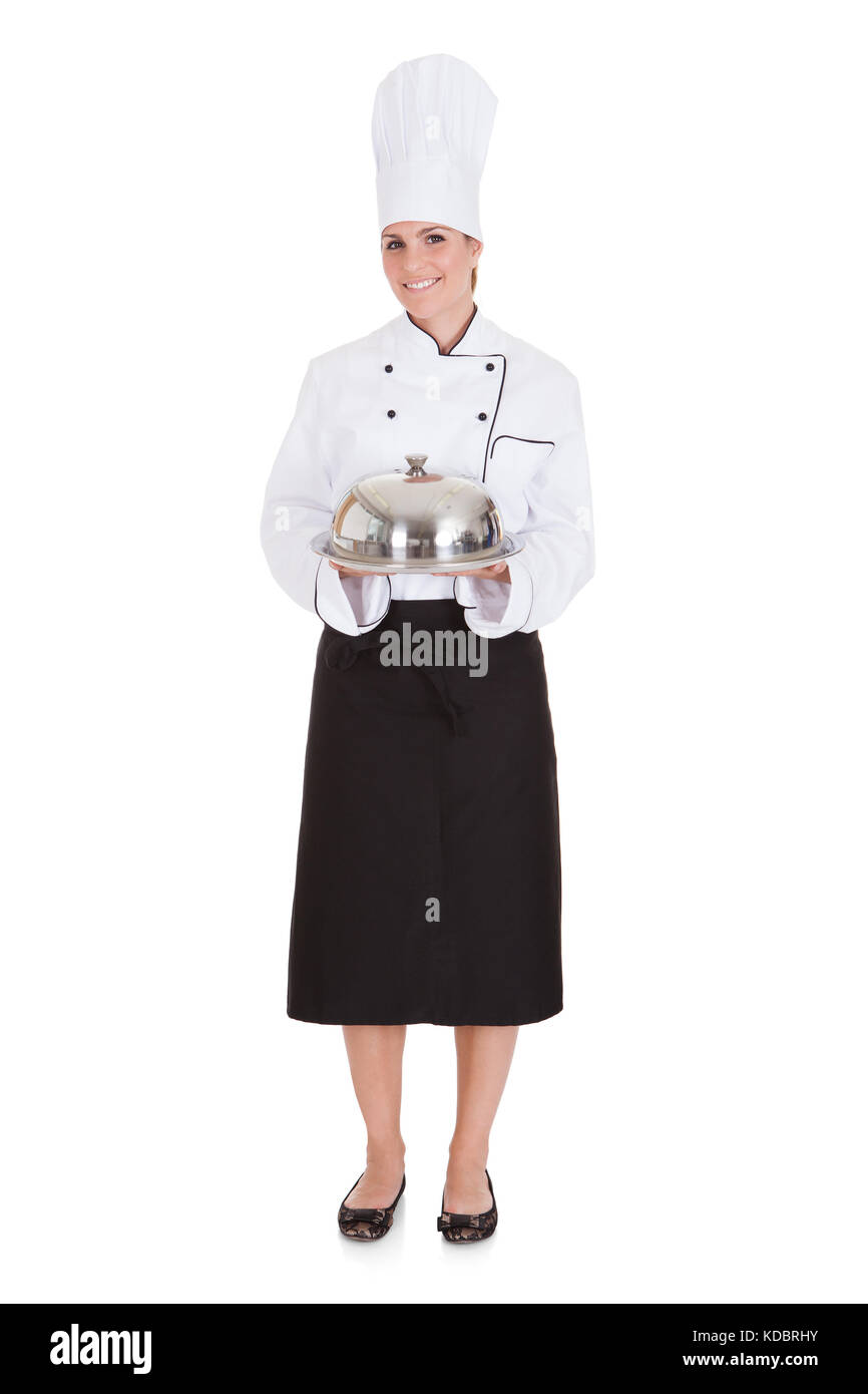 Portrait Of Female Chef Holding Tray Over White Background Stock Photo ...
