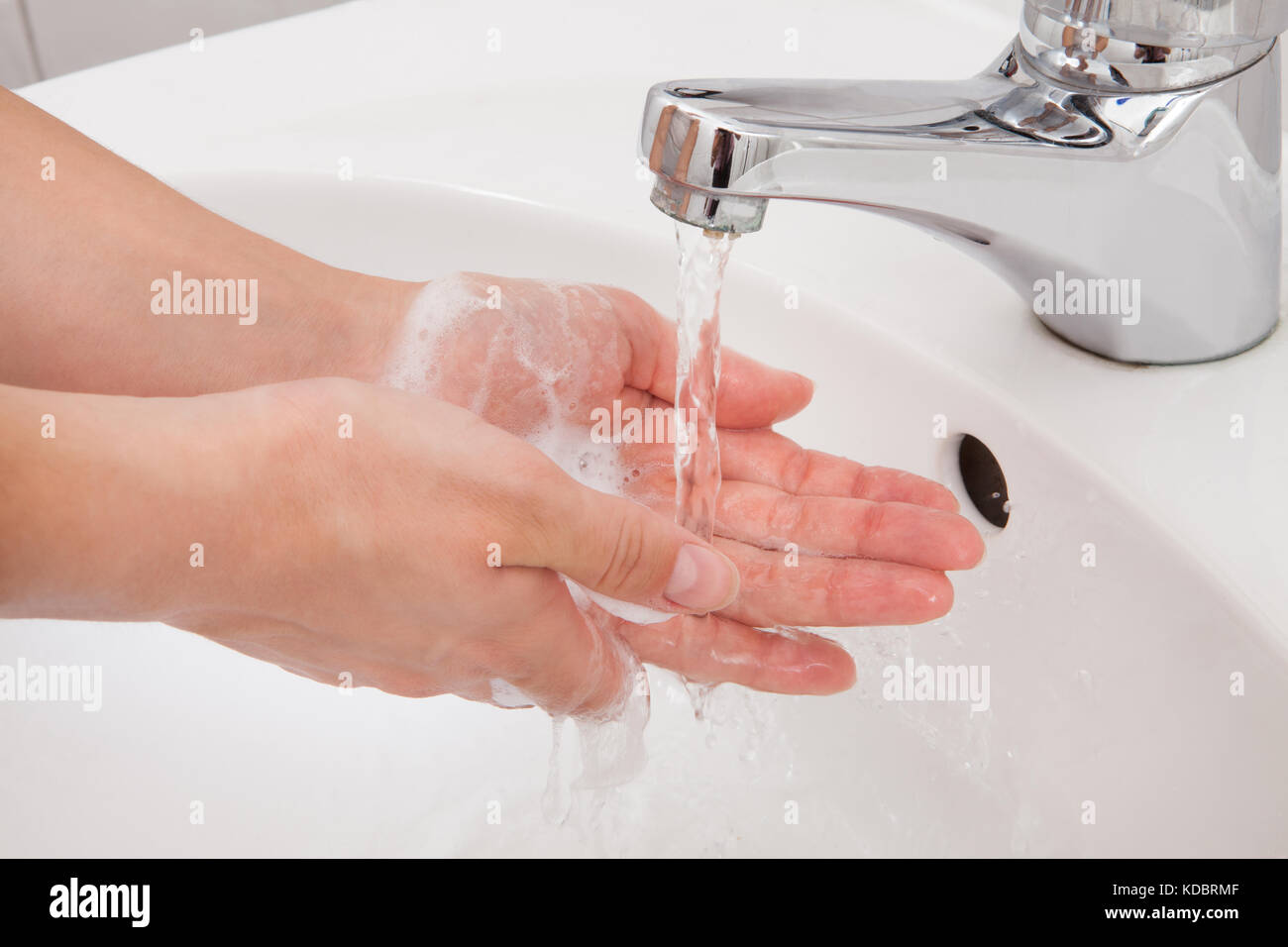 Hand under faucet hi-res stock photography and images - Alamy