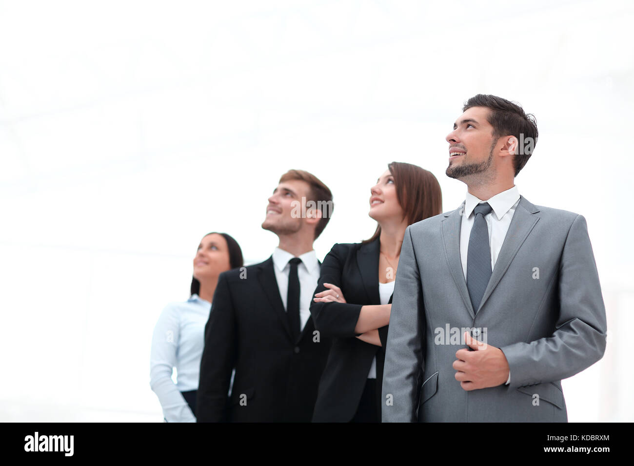 business team standing one behind the other and looking forward Stock ...