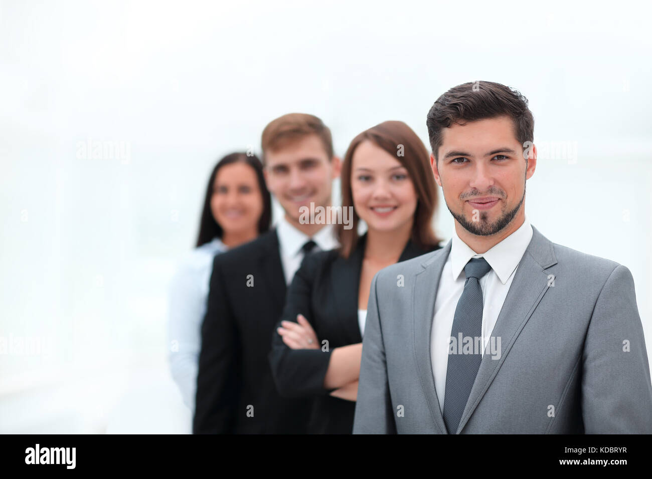 leader and the business team standing one behind the other Stock Photo ...