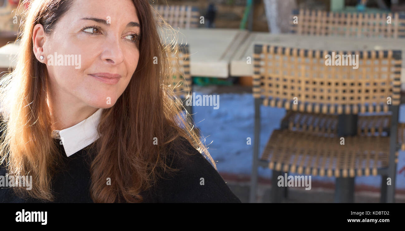 Portrait of a mature woman, 46 years, looking away, outdoors, profile ...