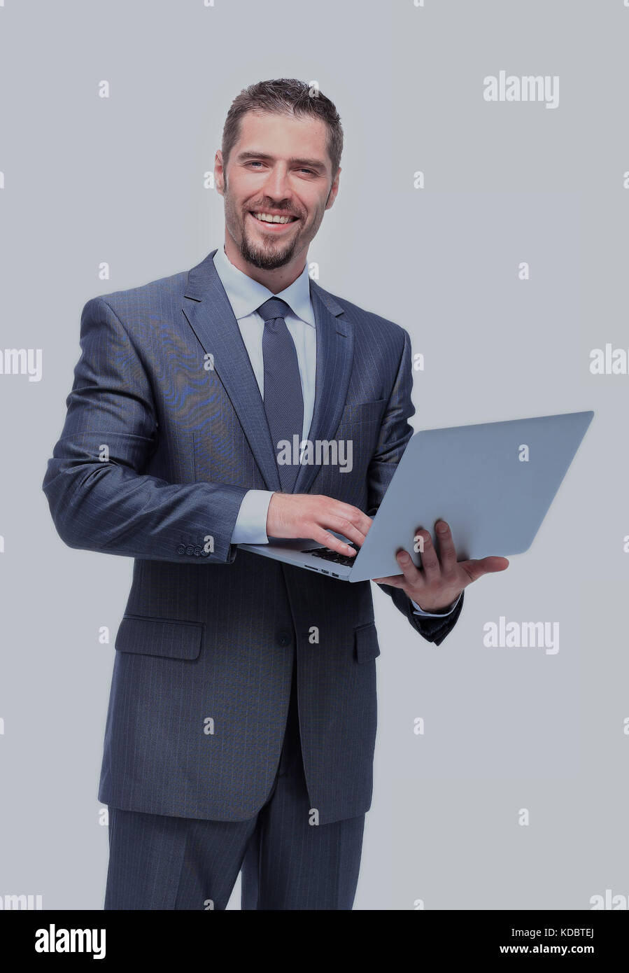 Businessman with laptop Stock Photo - Alamy