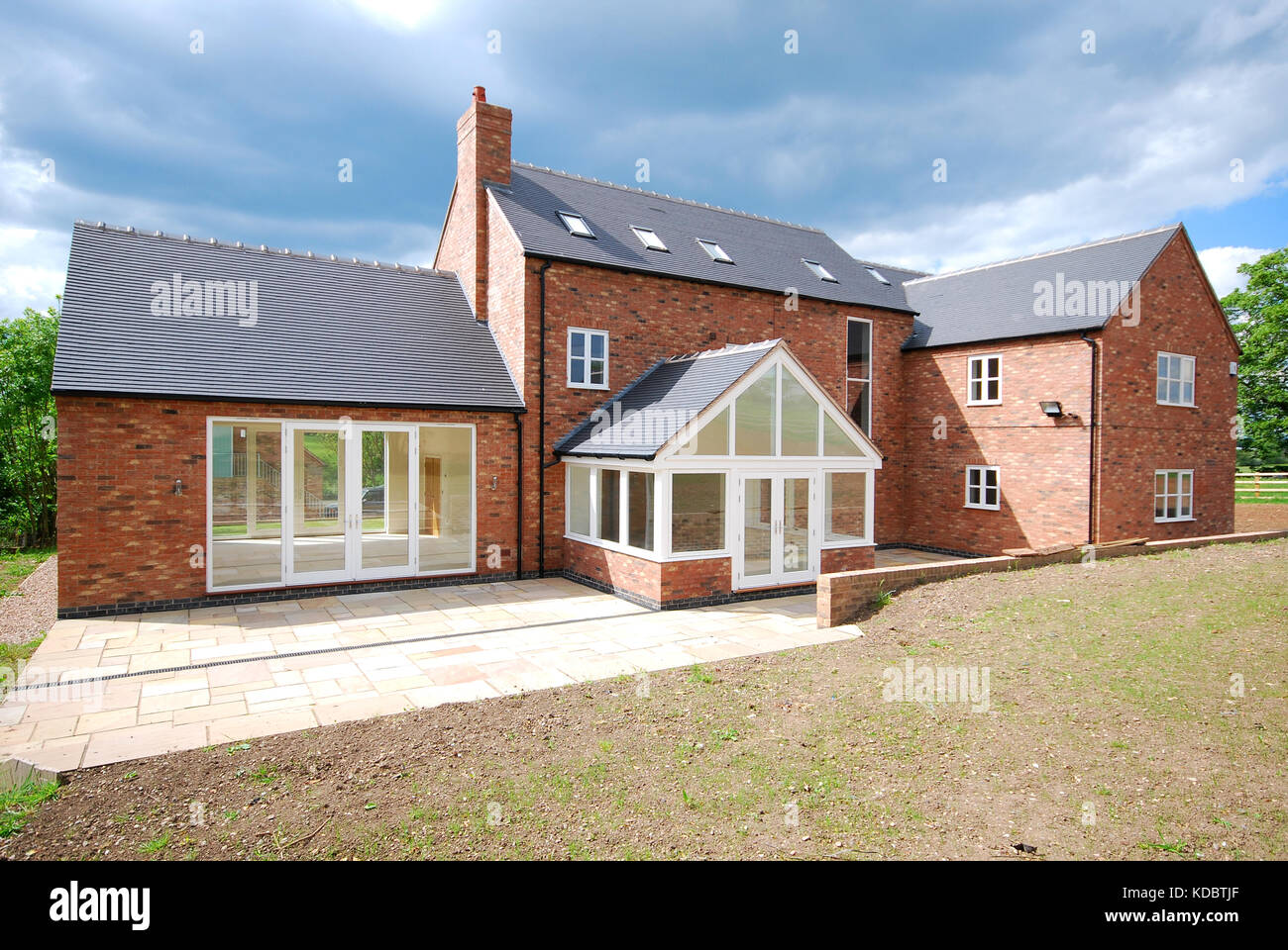 Large new build luxury house with bifold doors and conservatory Stock ...