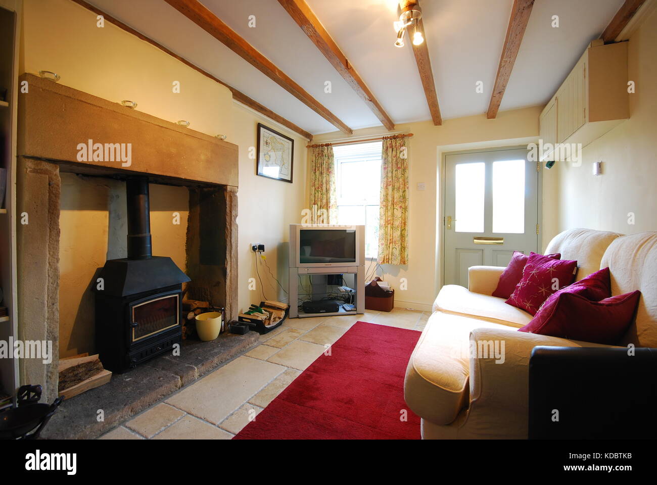 Snug living room in small Derbyshire cottage Stock Photo - Alamy