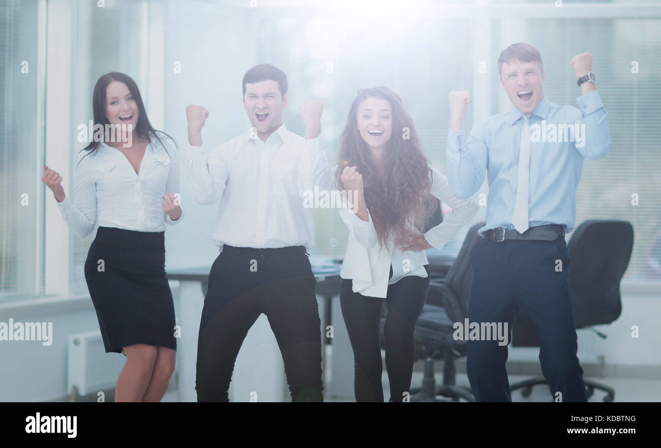 concept of team work:successful business team standing in office Stock ...