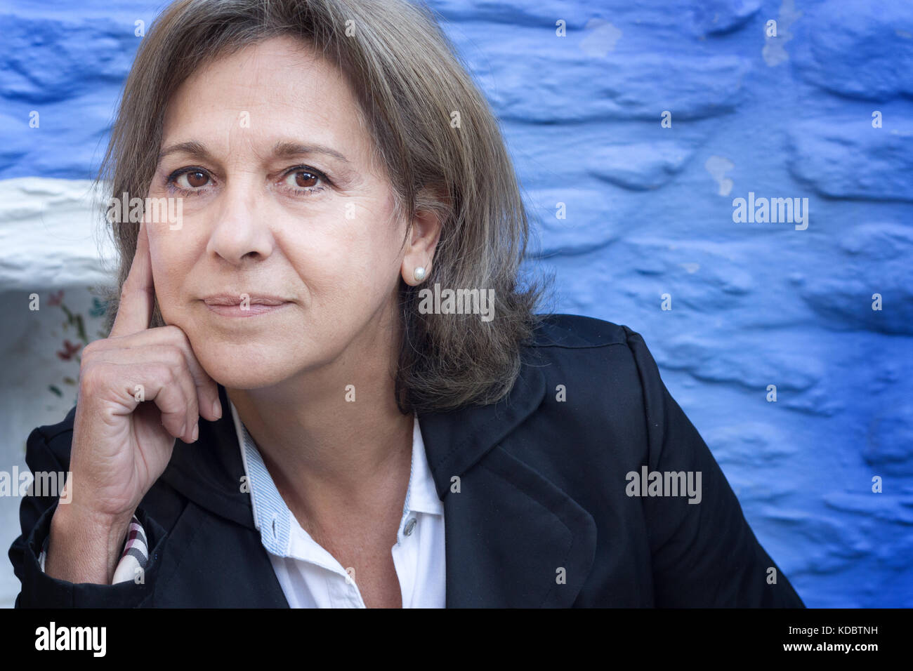 Portrait of a senior woman of 61 years old, looking at camera ...