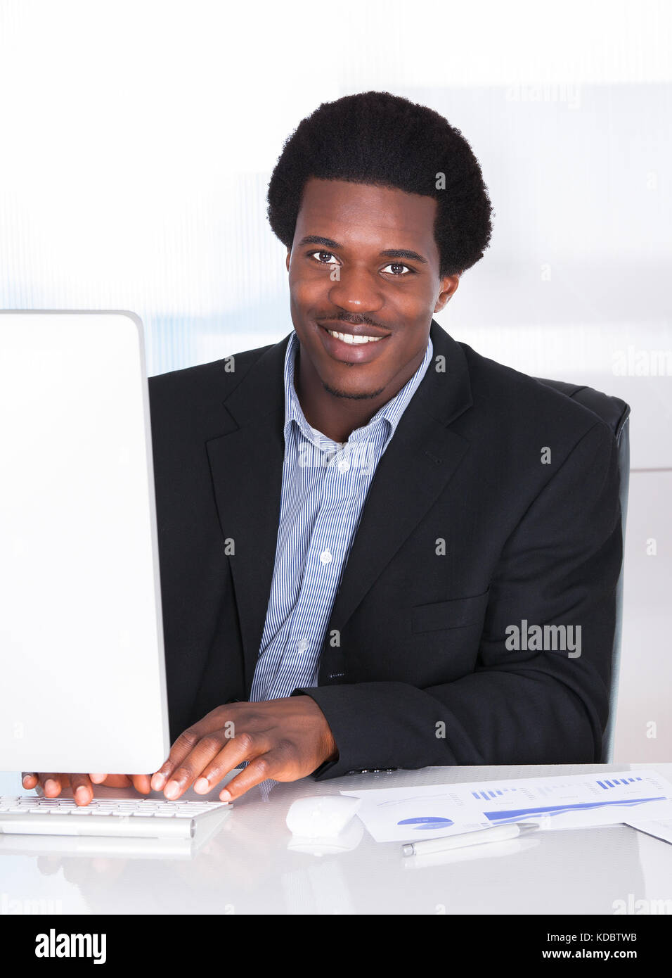 Black male student working at computer hi-res stock photography and ...