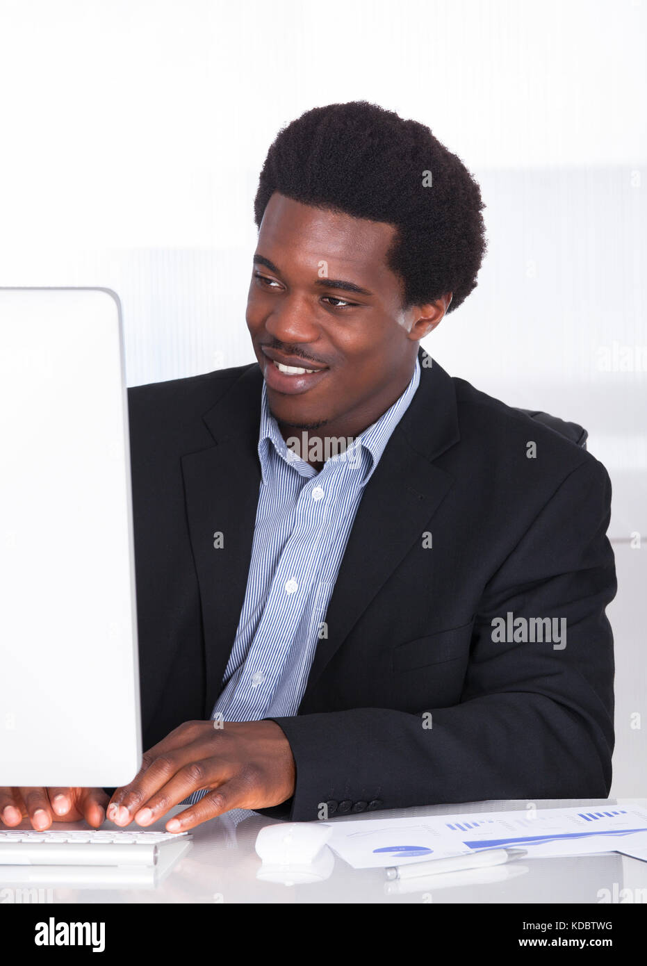 Happy Businessman Working On Computer In Office Stock Photo - Alamy