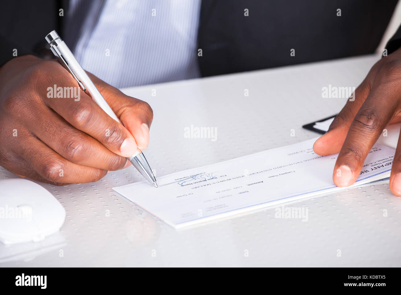 Hand writing cheque hi-res stock photography and images - Alamy
