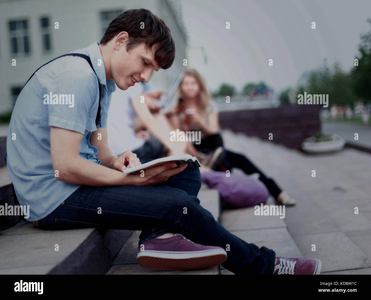 young man read book Stock Photo - Alamy