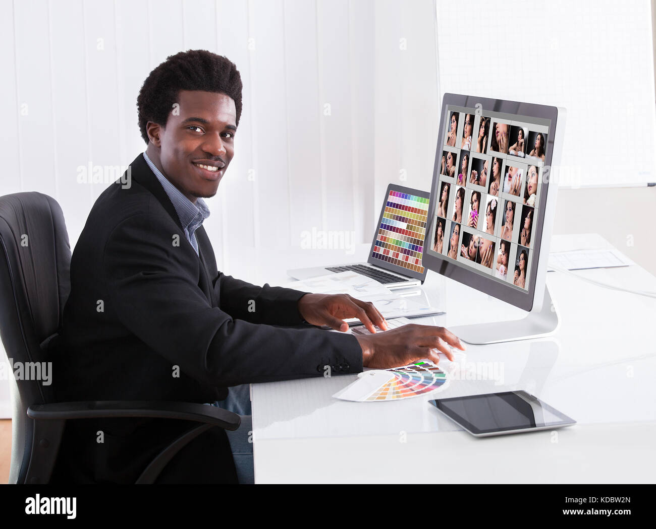 Portrait Of Happy Professional Businessman Editing Images In Office ...