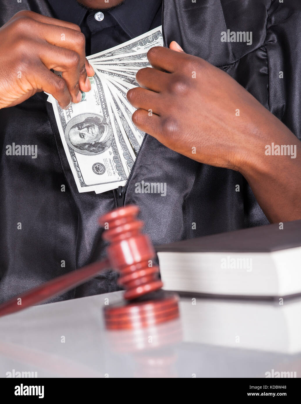 Male Judge Putting Some Money In His Pocket In A Courtroom Stock Photo ...