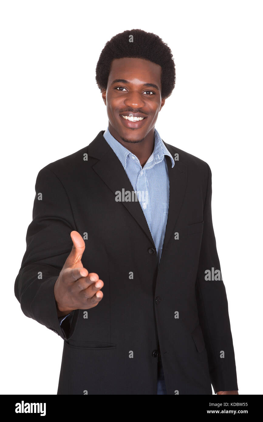 Happy Young Businessman Extending Hand To Shake Stock Photo - Alamy