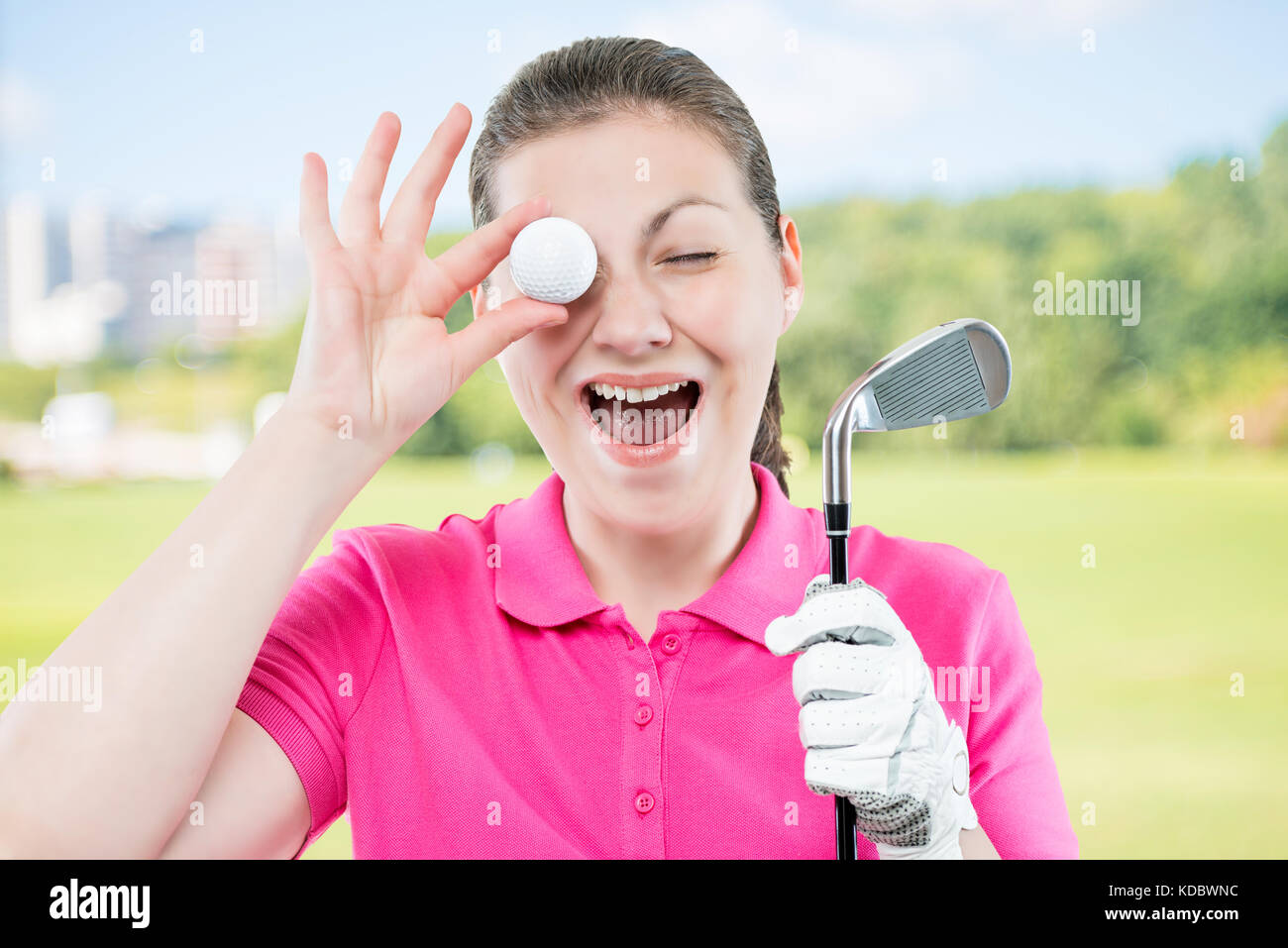 woman golfer funny portrait on a background of golf courses Stock Photo ...