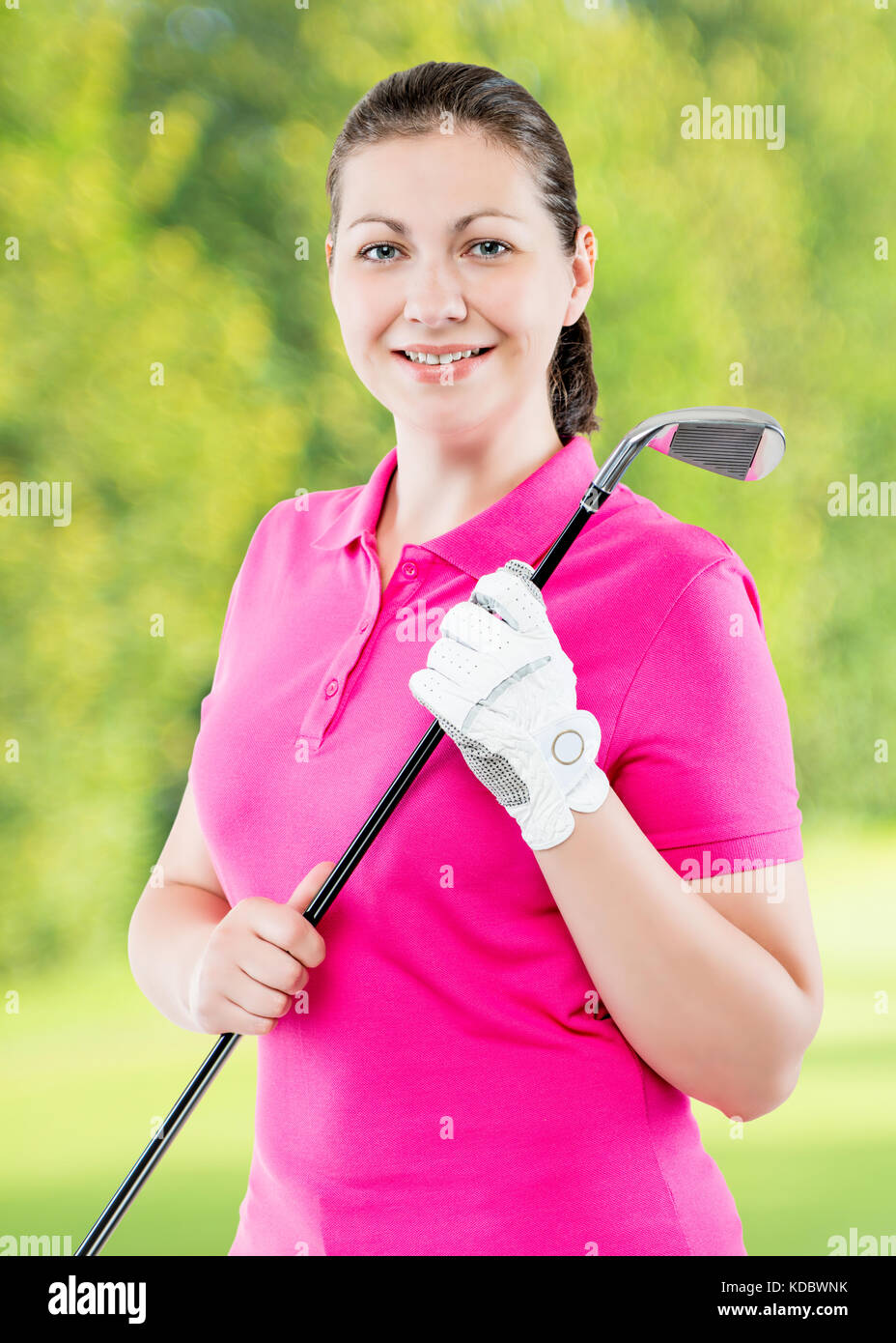 smiling happy woman golfer posing on a background of golf courses Stock ...