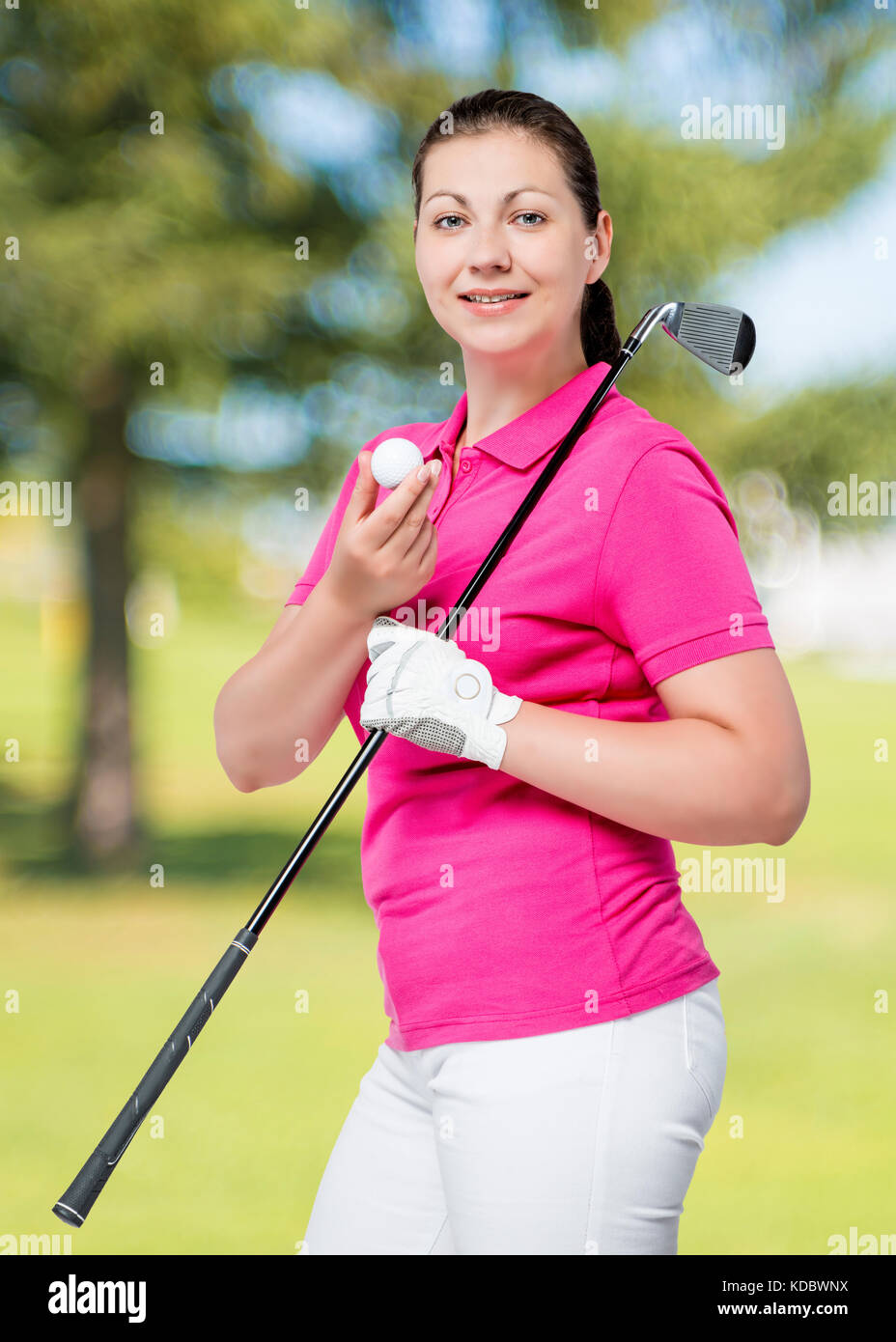 young professional golfer posing on a background of golf courses Stock ...