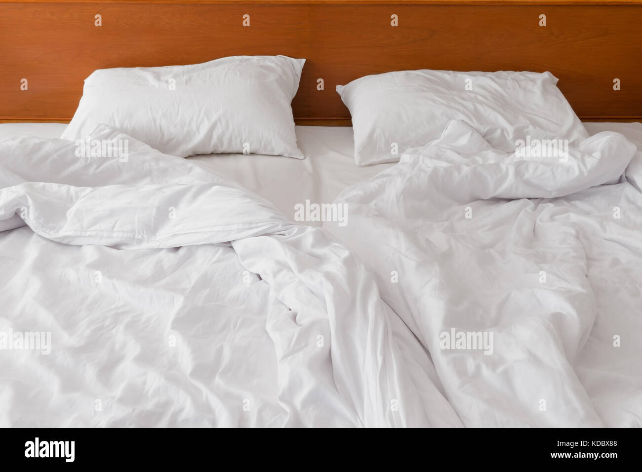 crumpled bed white linen in the morning to the hotel after the guests ...