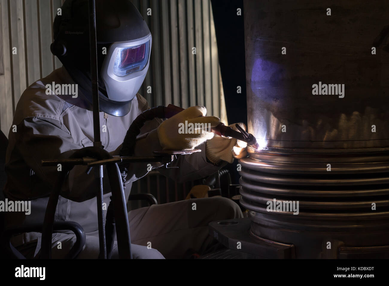 Welder with protective mask welding metal and sparks Stock Photo - Alamy