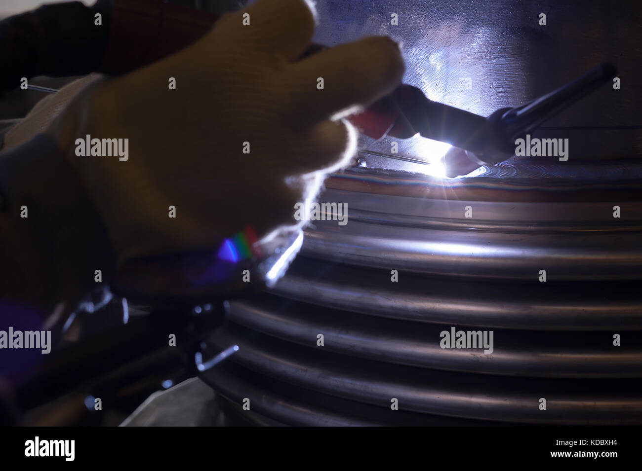 Welder with protective mask welding metal and sparks Stock Photo - Alamy