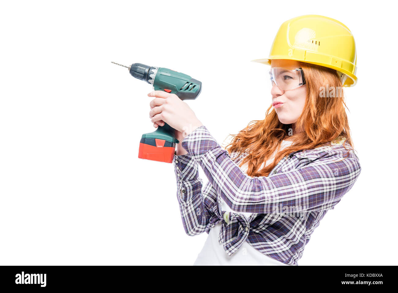 fragile girl with a man's tool on a white background, space left Stock ...