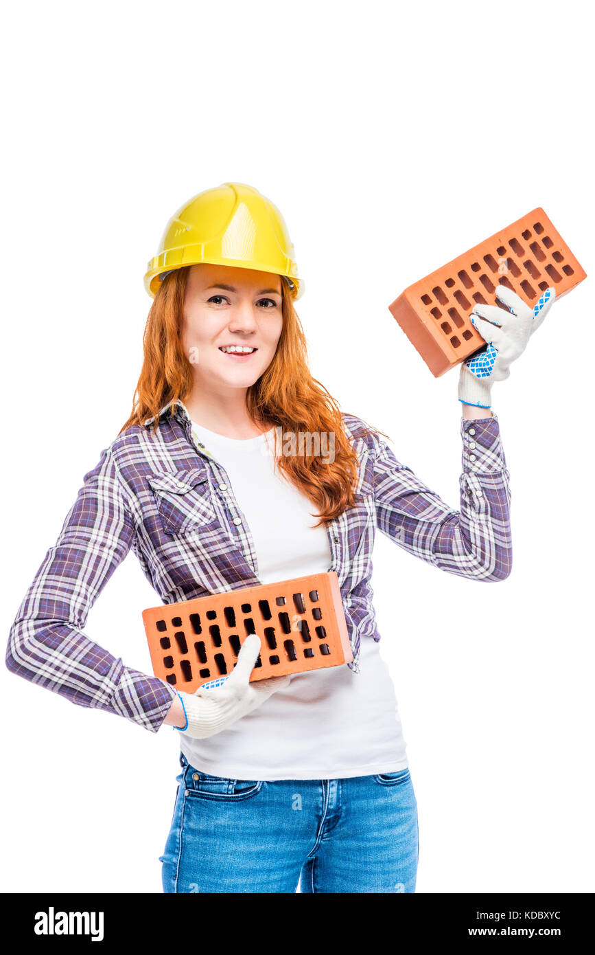 strong woman builder in yellow breeze with bricks on white background ...