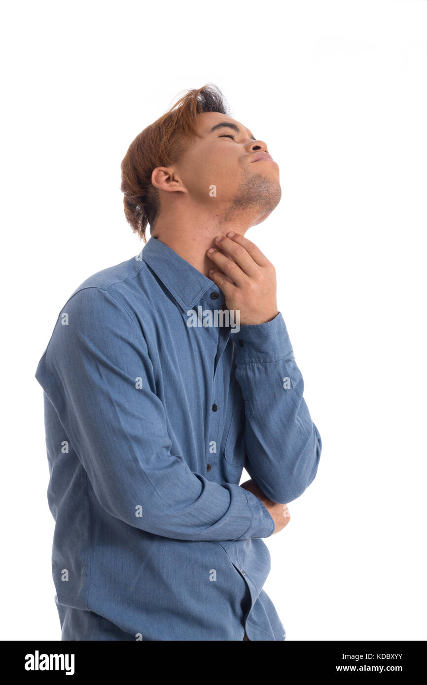 Young worker stands with hand on neck. He feels pain, he has a cold ...