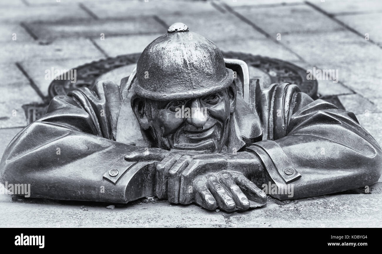 Cumil the Sewer Worker, Man at Work famous bronze statue in Old Town ...