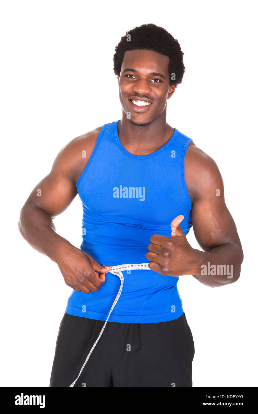 Happy Bodybuilder Measuring His Waist Showing Thumb Up Sign Stock Photo ...