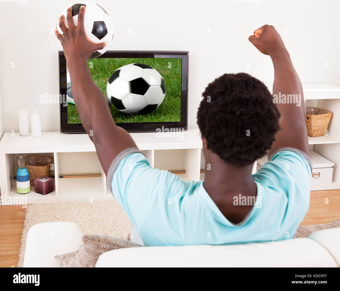 Close up man cheering watching tv hi-res stock photography and images ...