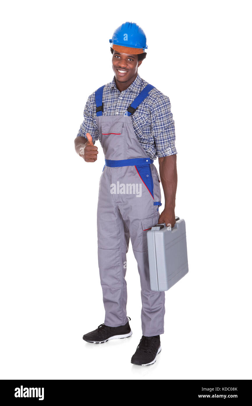 Portrait Of A Young African Craftsman Showing His Thumb Up Over White ...