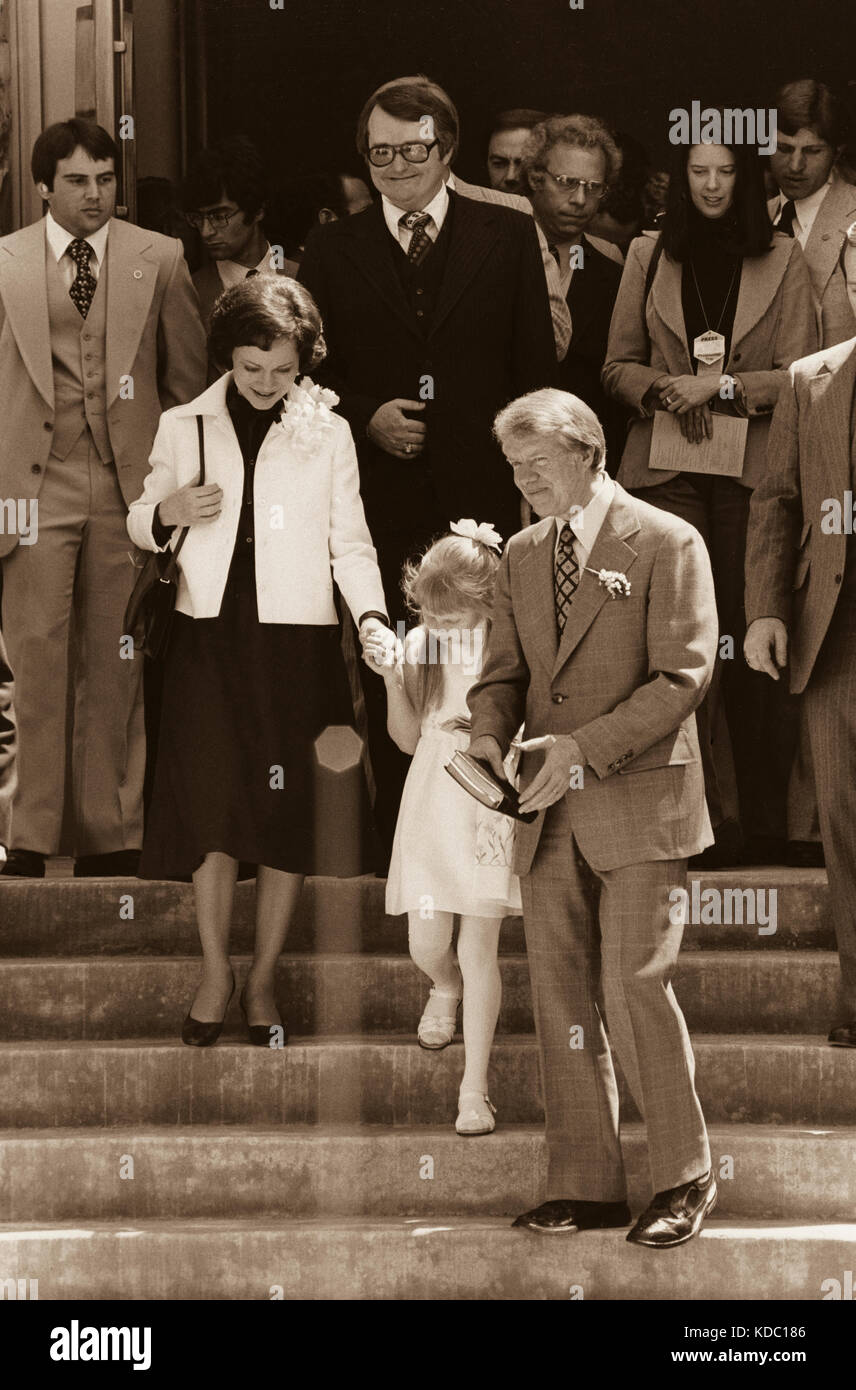 President Jimmy Carter leaves a 1977 church service with Rosalyn and ...