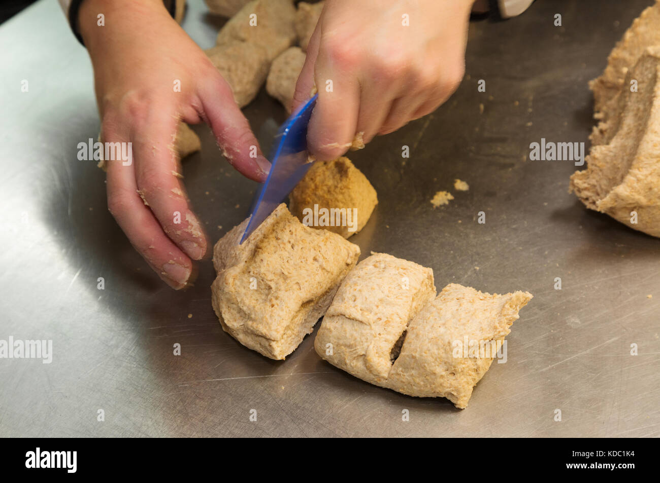 Baker in bakery making bread hi-res stock photography and images - Alamy