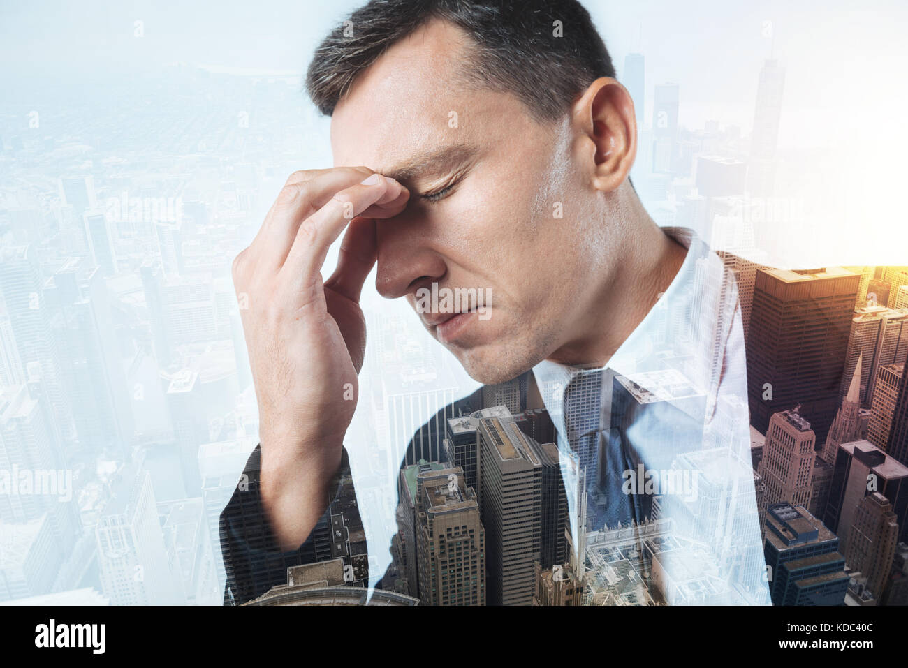 Sad gloomy man making difficult decision Stock Photo - Alamy